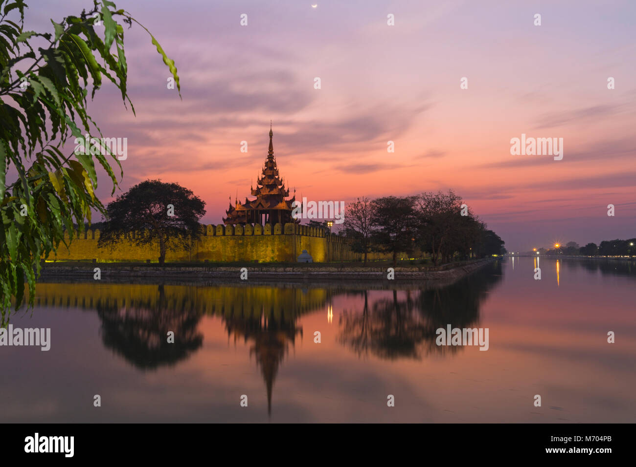 Moat bastion and city wall of Mandalay Royal Palace at sunset with ...