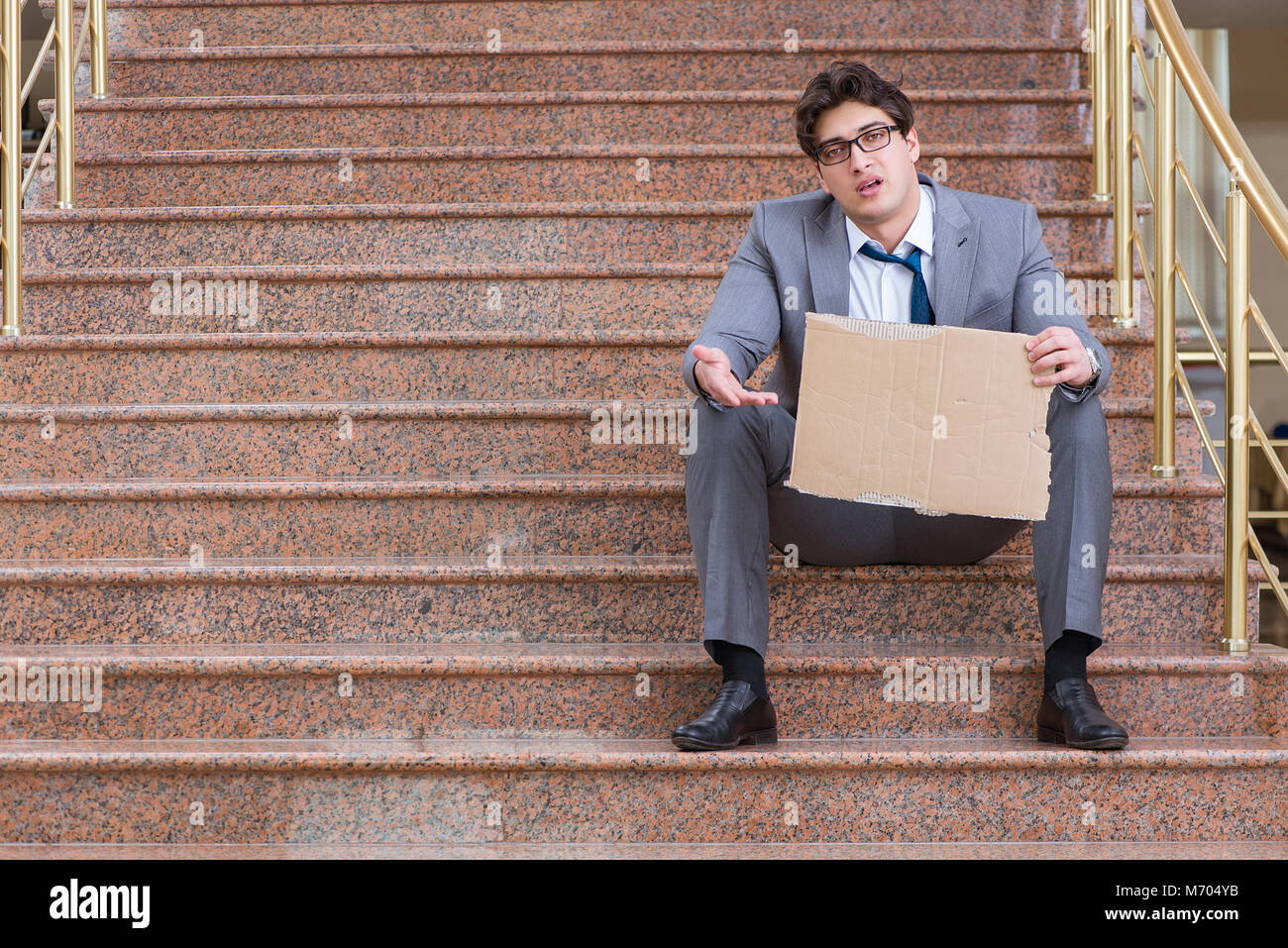 Desperate businessman begging on the street Stock Photo - Alamy