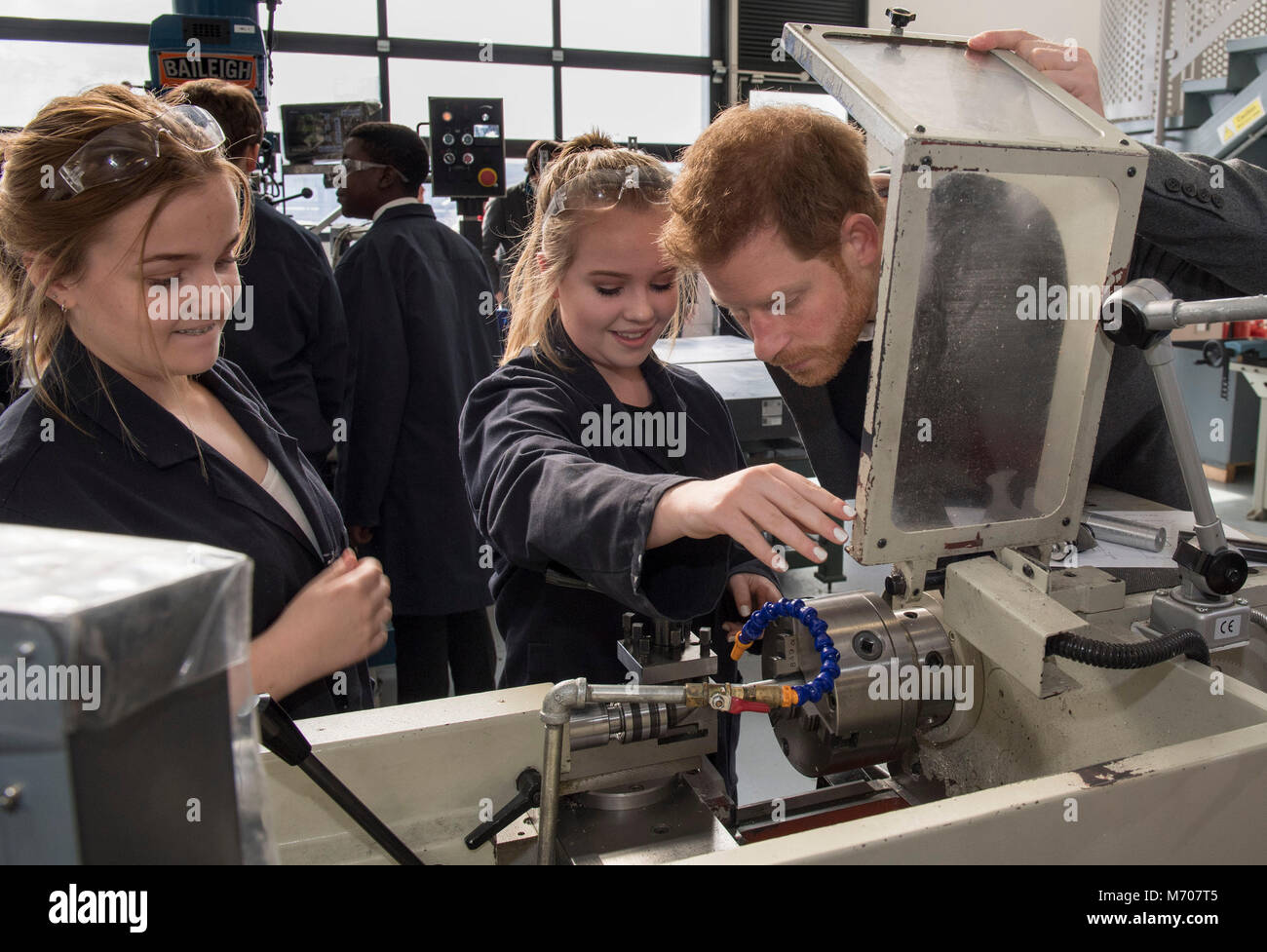 Prince Harry, talks to students Tara Vooght and Lauren Bull (left) who ...