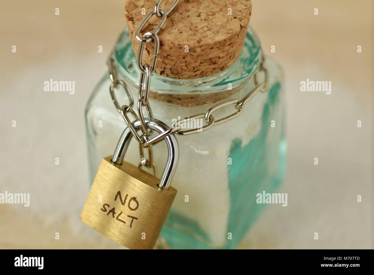 Salt jar wrapped in metal chain and padlock - No salt diet concept ...