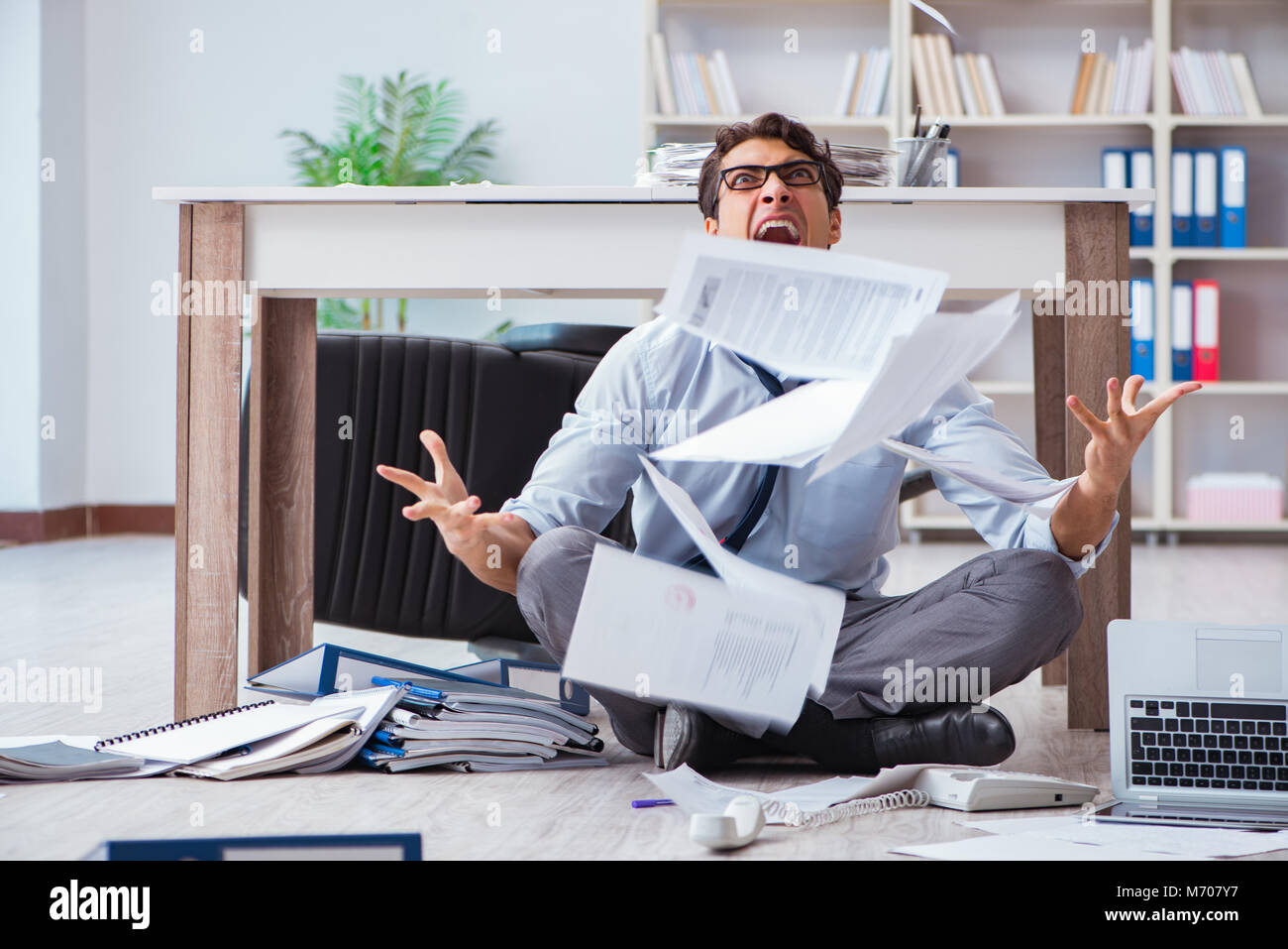 Bankrupt businessman angry in the office floor Stock Photo - Alamy
