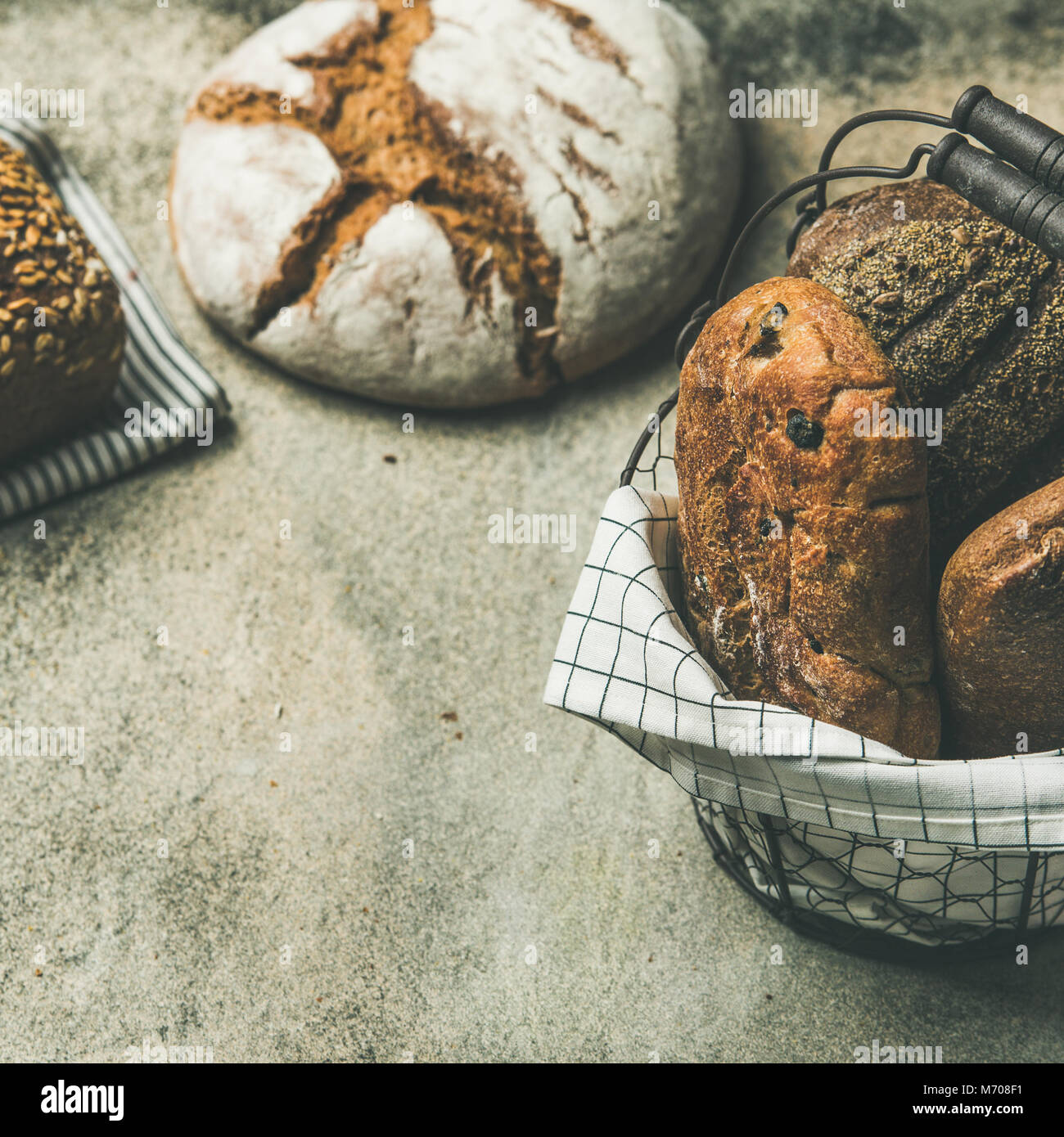 Various bread loaves on grey concrete background, square crop Stock ...