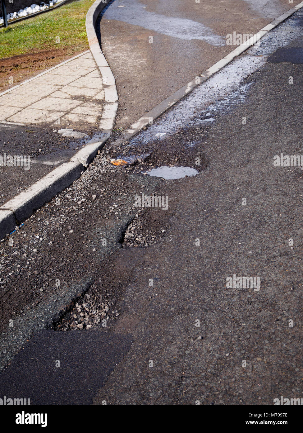 Potholes in a UK road Stock Photo - Alamy