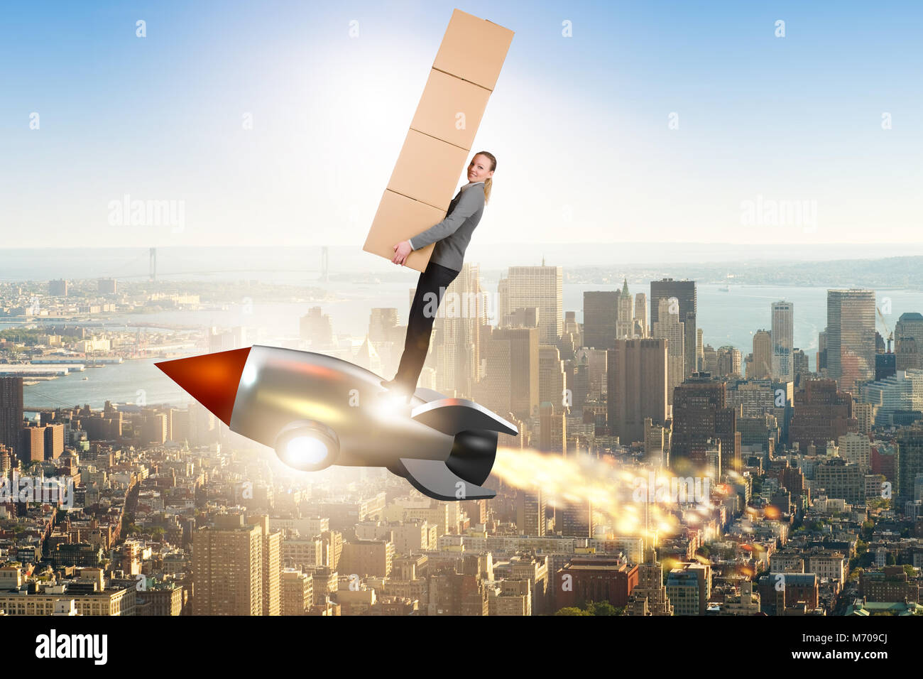 Woman flying rocket and delivering boxes Stock Photo - Alamy