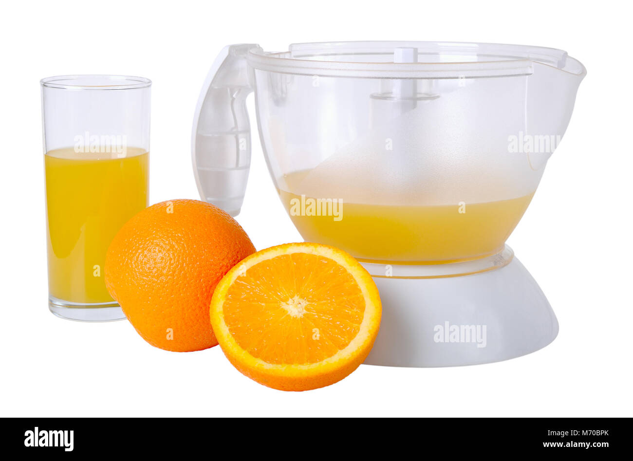Still life with a juice extractor isolated on white Stock Photo - Alamy