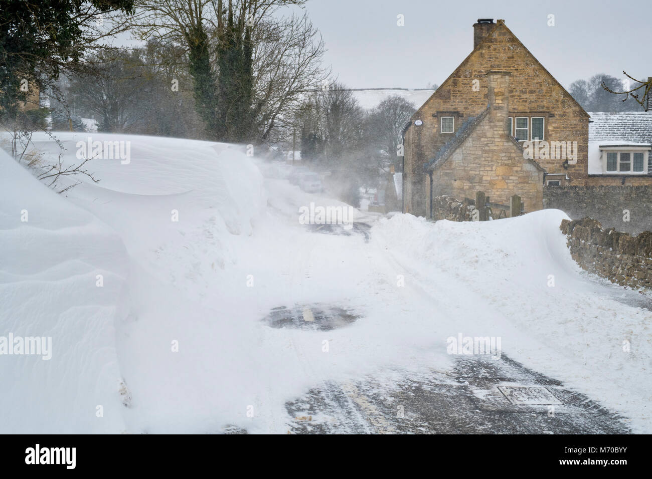 Snowdrifts across the road in Snowshill village in March. Snowshill ...