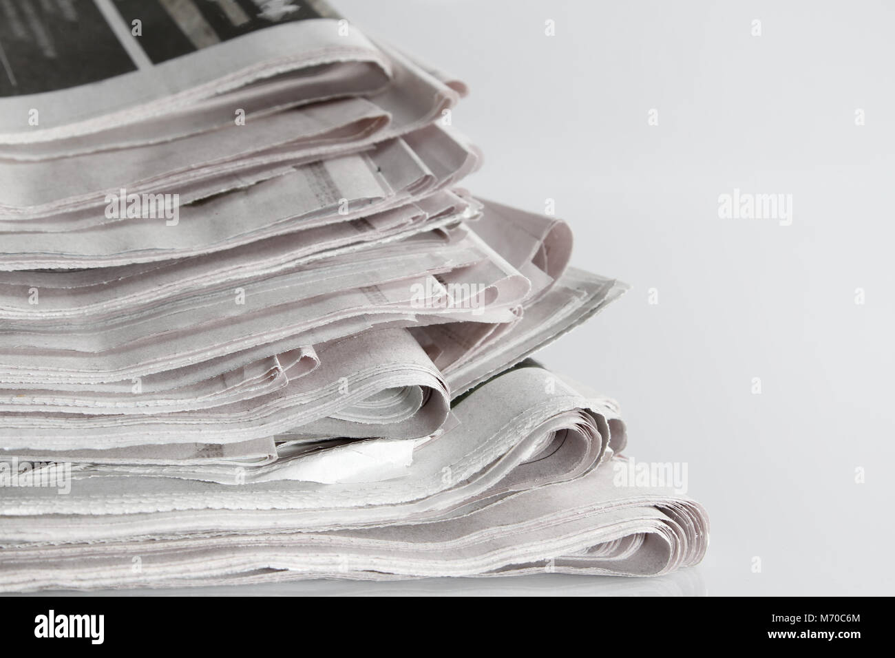Closeup of pile of newspapers Stock Photo - Alamy
