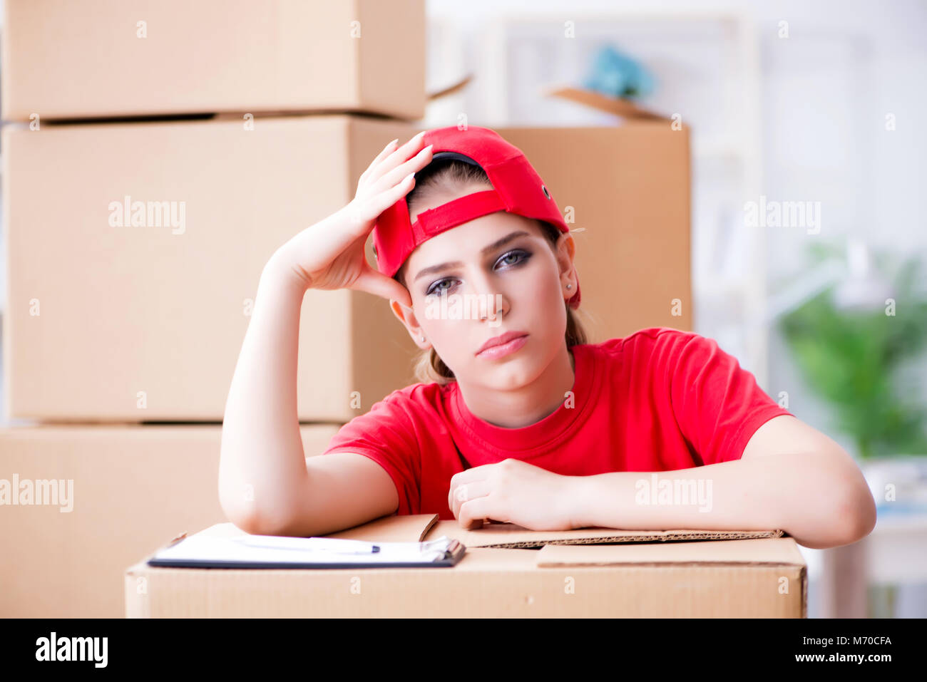 Young woman delivering boxes of personal effects Stock Photo - Alamy