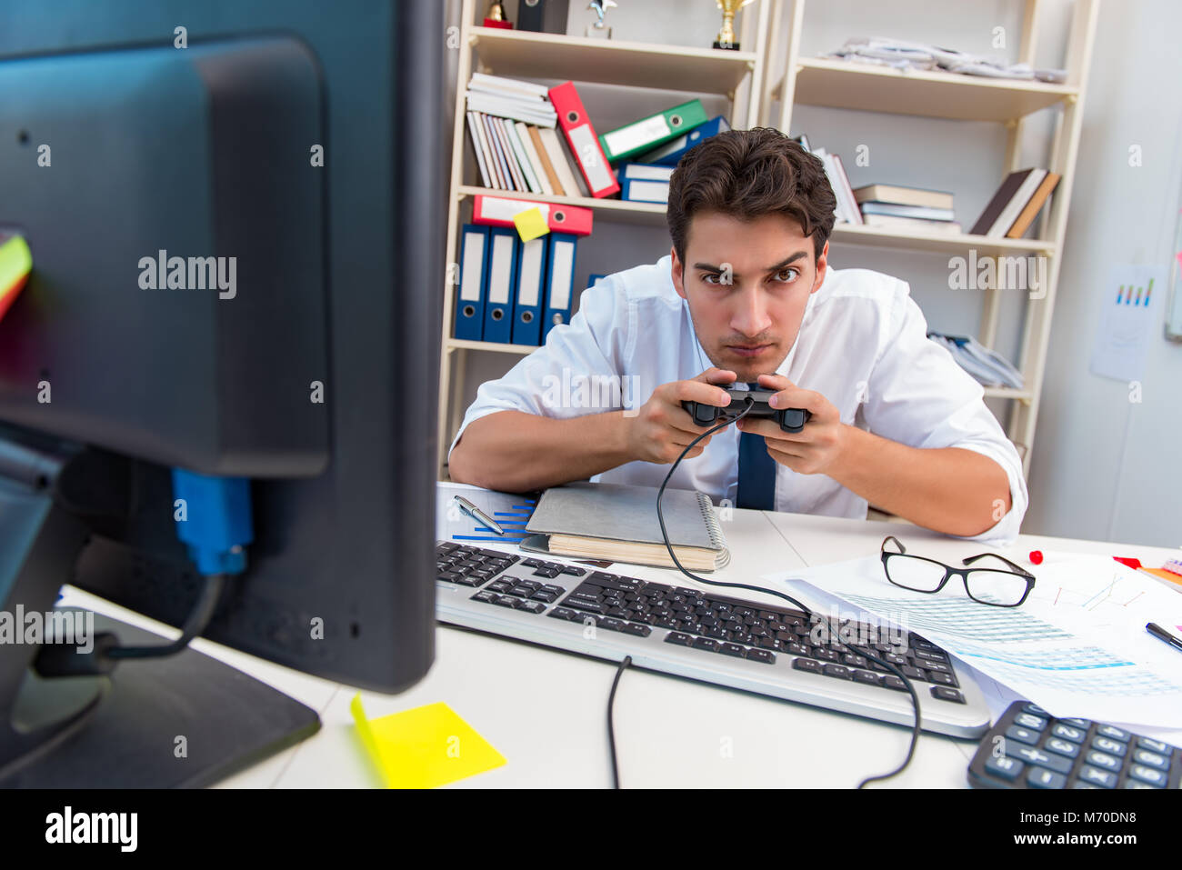 Employee playing computer games in the office Stock Photo - Alamy