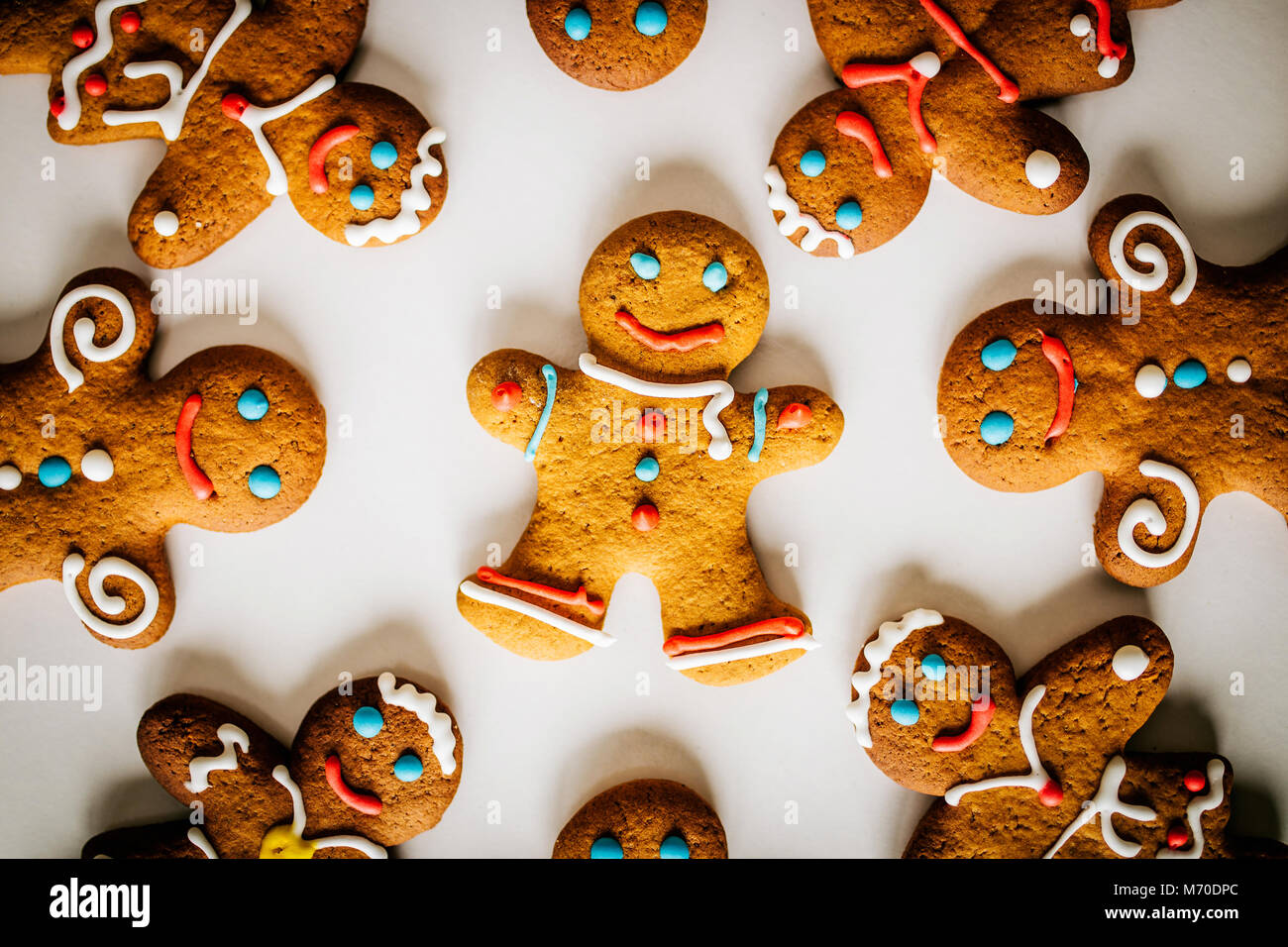 Gingerbread men on white background Stock Photo - Alamy