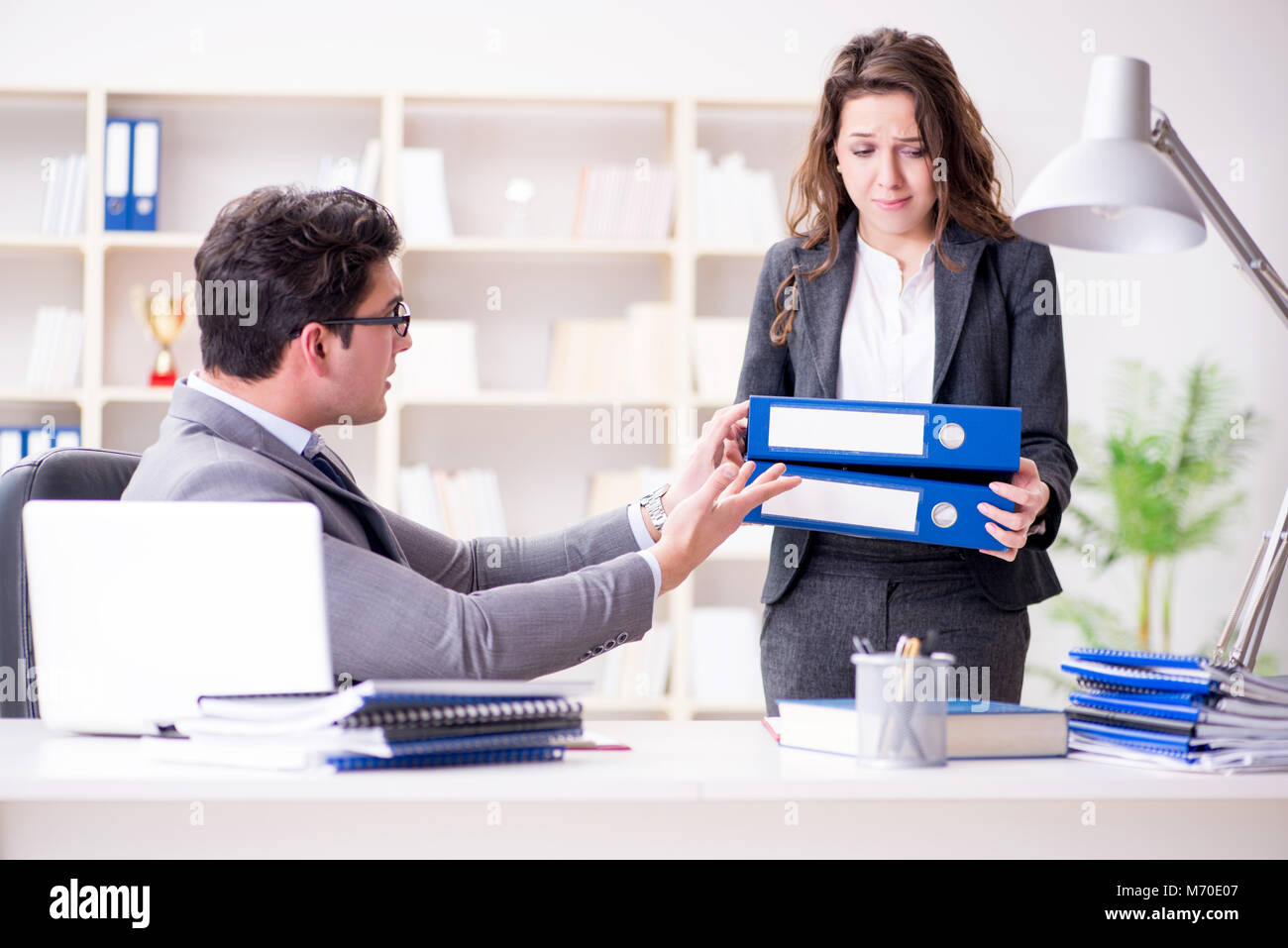 Angry boss unhappy with female employee performance Stock Photo - Alamy