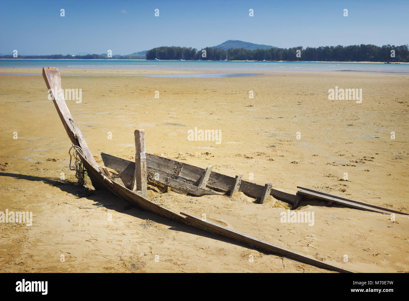 Skeleton of destroyed boat in area of sea tide Stock Photo - Alamy
