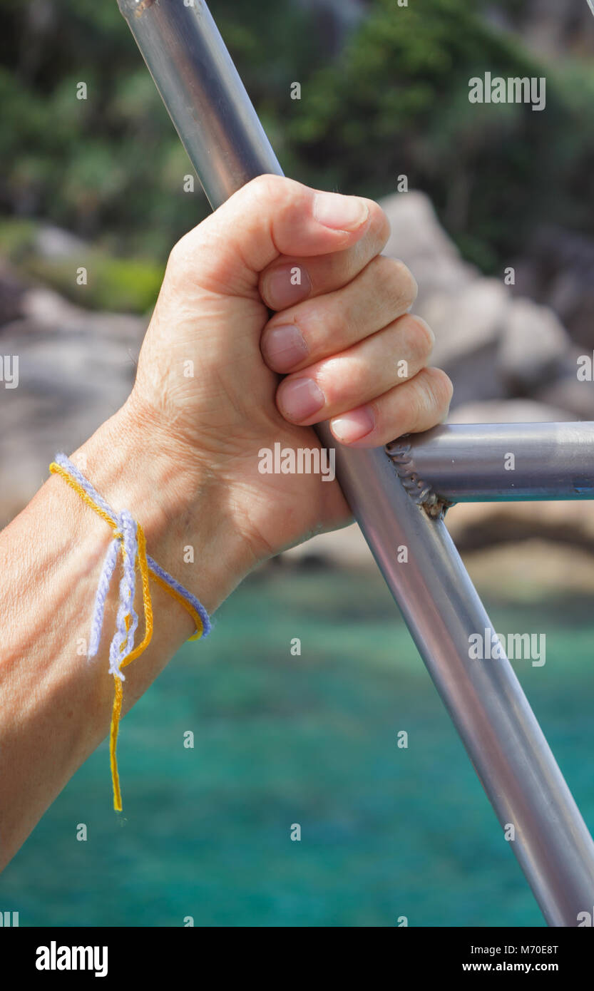 Man's hand on the handrail in a cruise ship sailing Stock Photo - Alamy