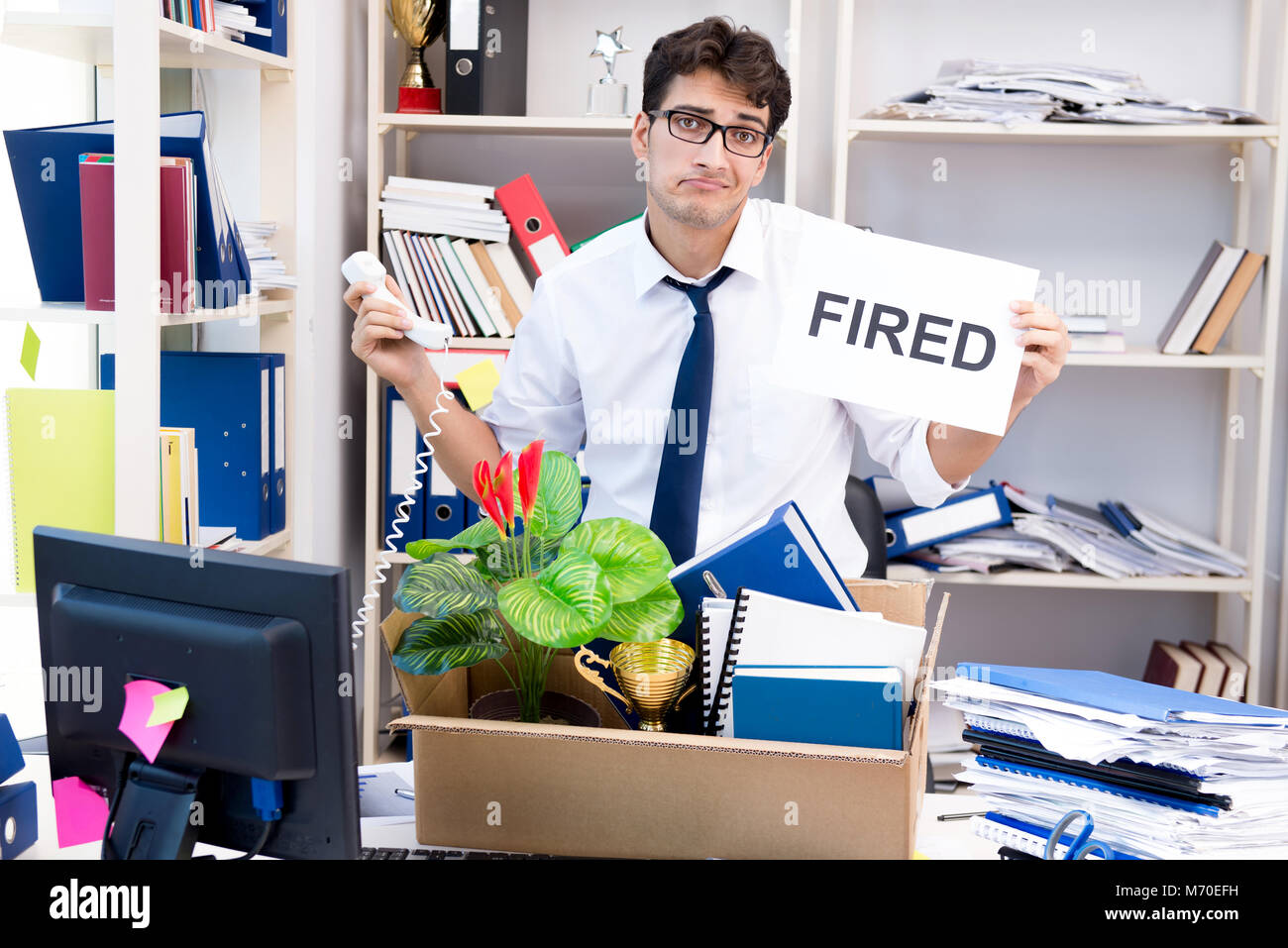 Employee being fired from work made redundant Stock Photo - Alamy