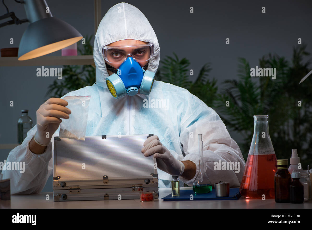 Forensic investigator collecting blood hi-res stock photography and ...
