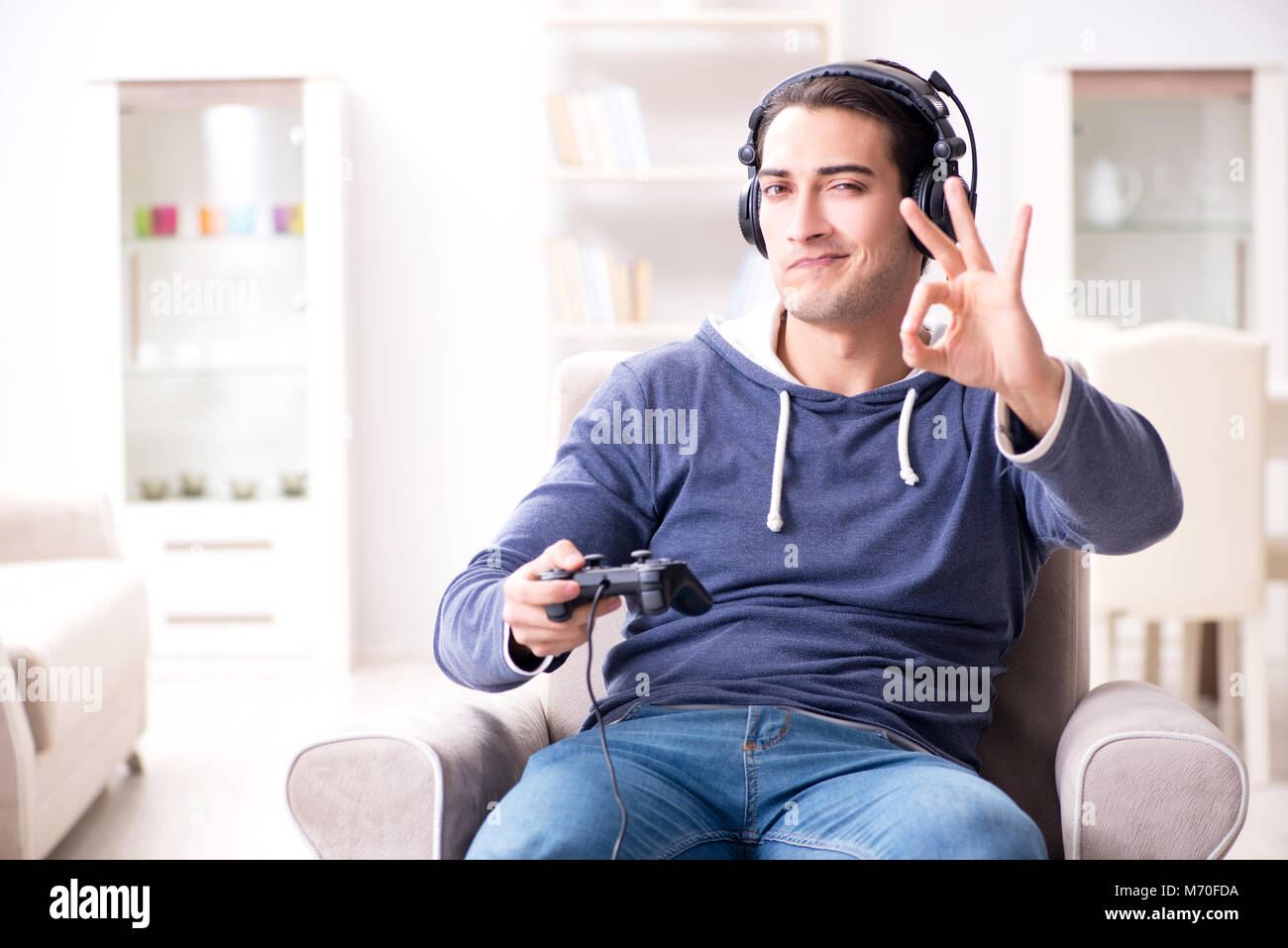 Young man playing computer games at home Stock Photo - Alamy