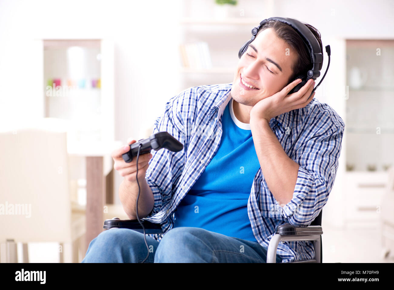 Disabled man playing computer games during rehabilitation Stock Photo ...