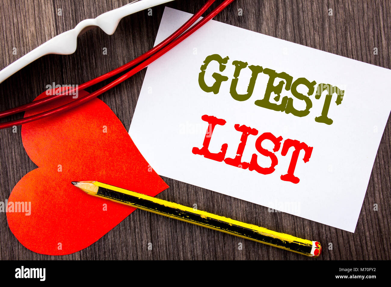 Handwriting text showing Guest List. Business concept for Planning ...