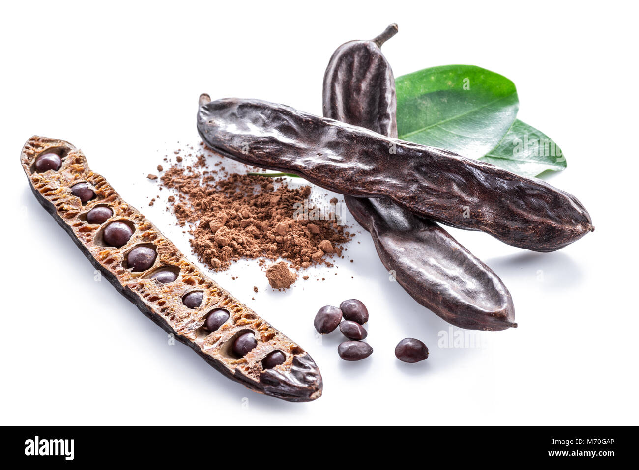 Carob pods and carob powder on the white background Stock Photo - Alamy