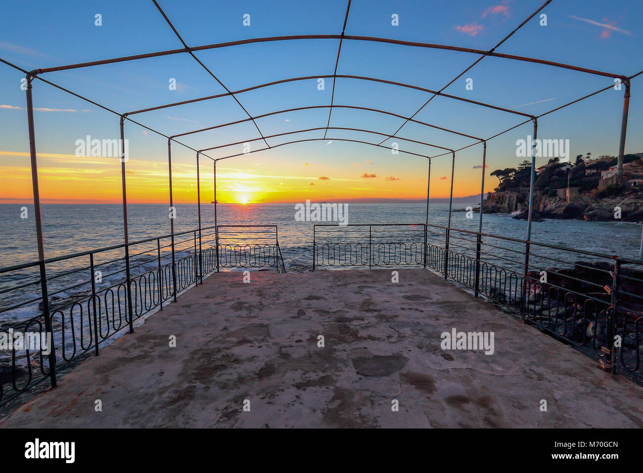 A beautiful sunset on the coast iside the cage Stock Photo - Alamy