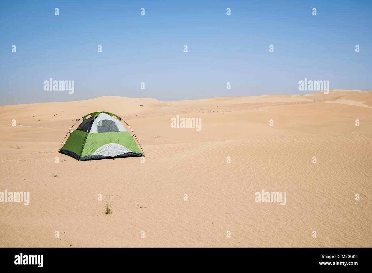 Isolated tent in the desert with space for text in the sky and in the ...