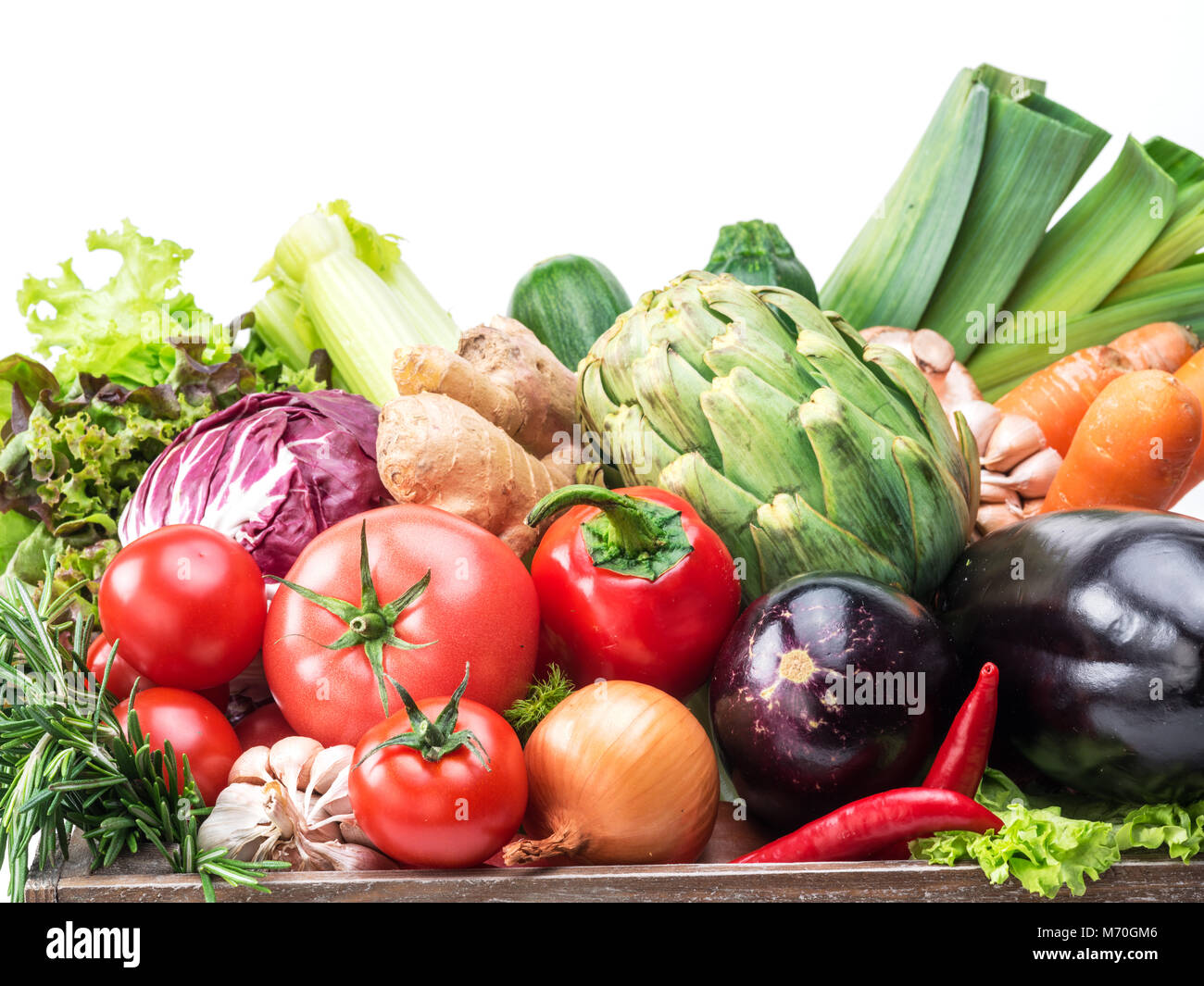 Fresh multi-colored vegetables in wooden crate Stock Photo - Alamy