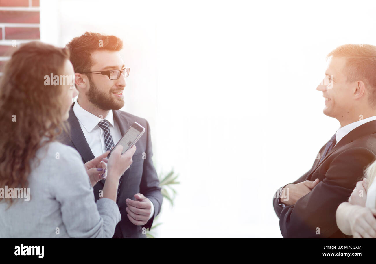 business partners communicating before the start of the official Stock ...