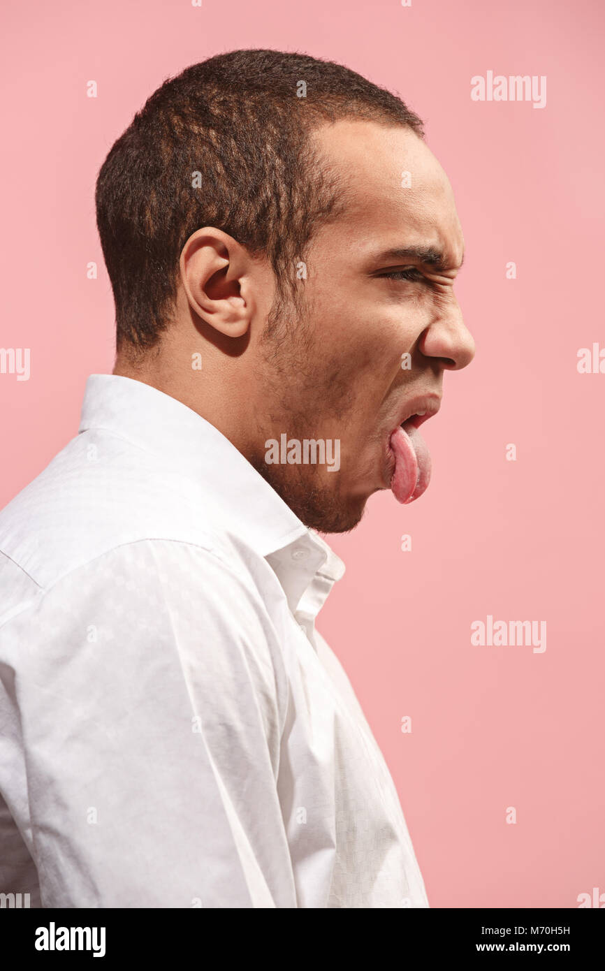 Young man with disgusted expression repulsing something, isolated on ...
