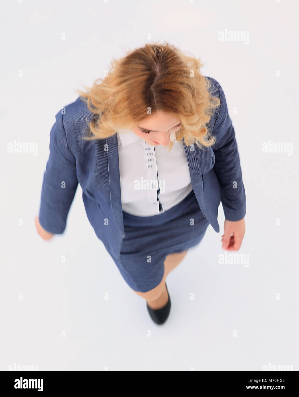 view from the top. business woman stepping forward Stock Photo - Alamy