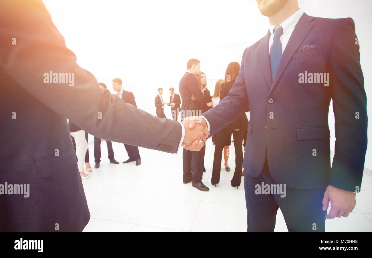 closeup of handshake of business partners on the background of business ...