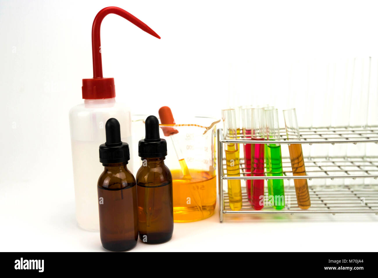 Stand with test tubes isolated on white. Several chemical solution in ...