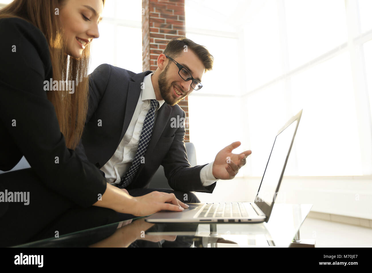 Talking business strategy in the boardroom Stock Photo - Alamy
