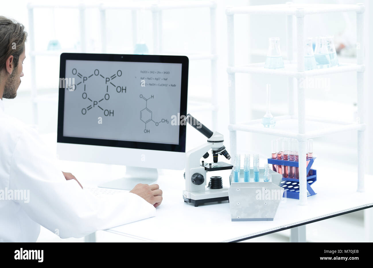 research scientist using computer chemistry laboratory Stock Photo - Alamy