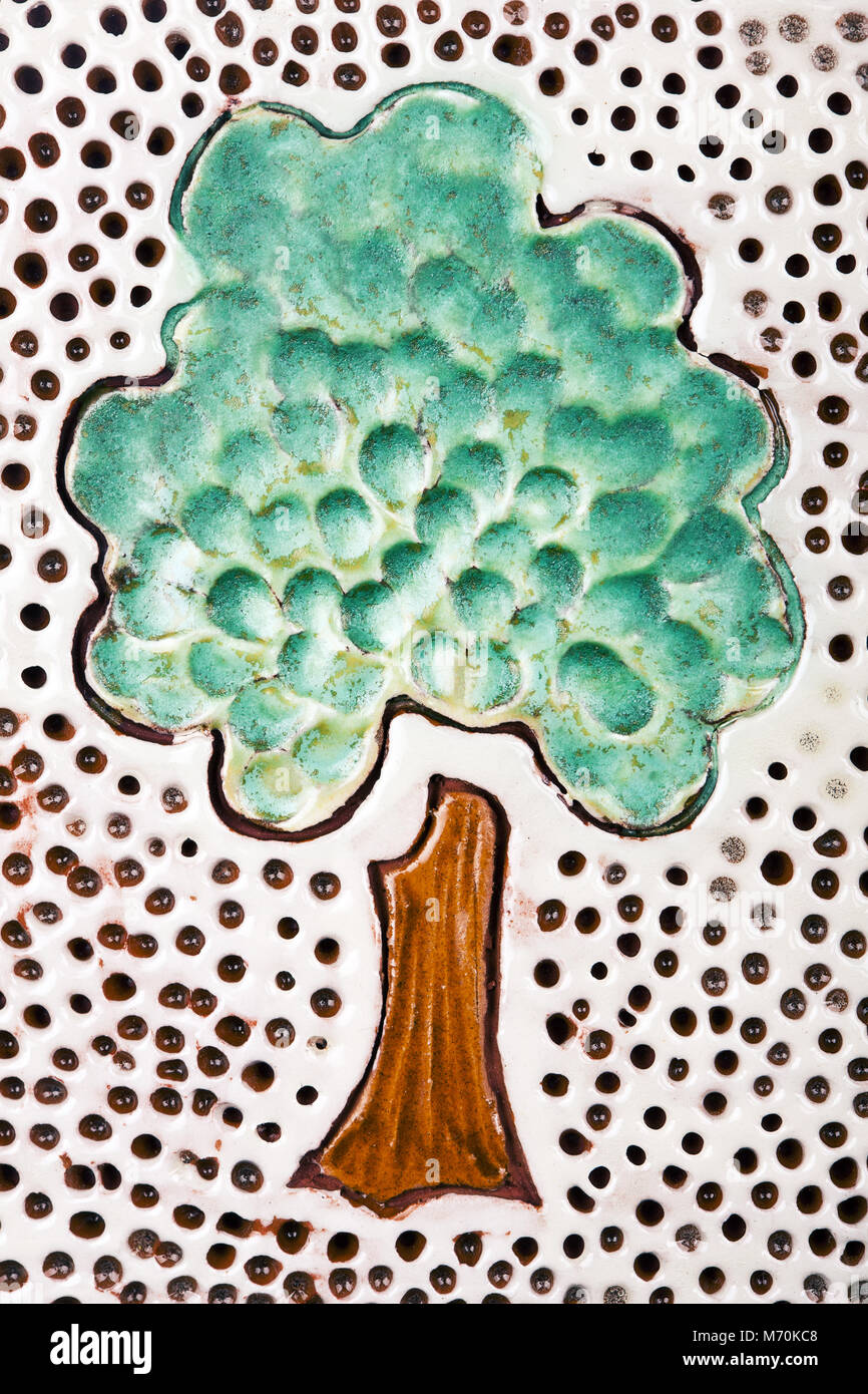 Handmade ceramic tree in a dotted background Stock Photo - Alamy