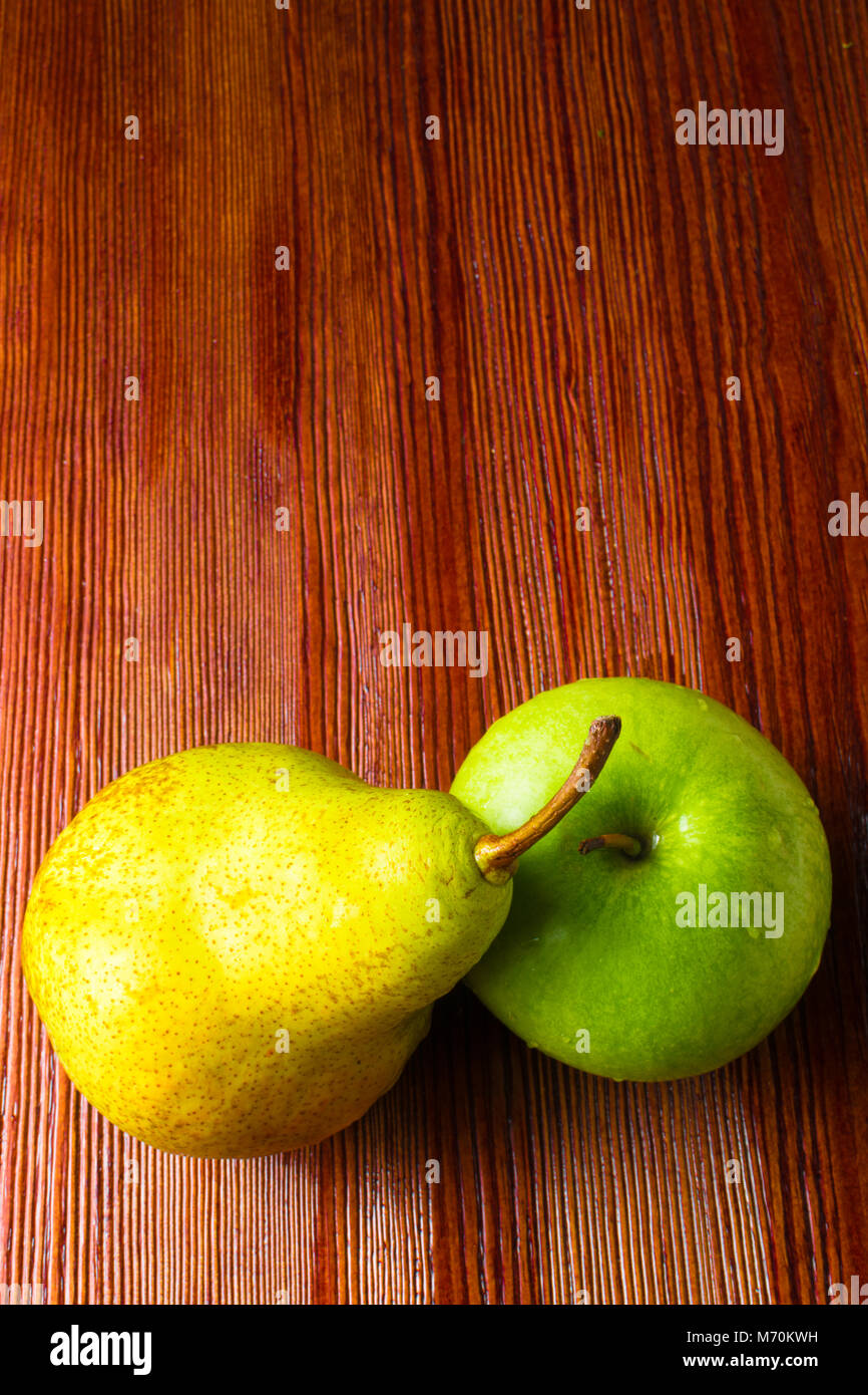 bio green organic apple and pear on wood ktable Stock Photo - Alamy