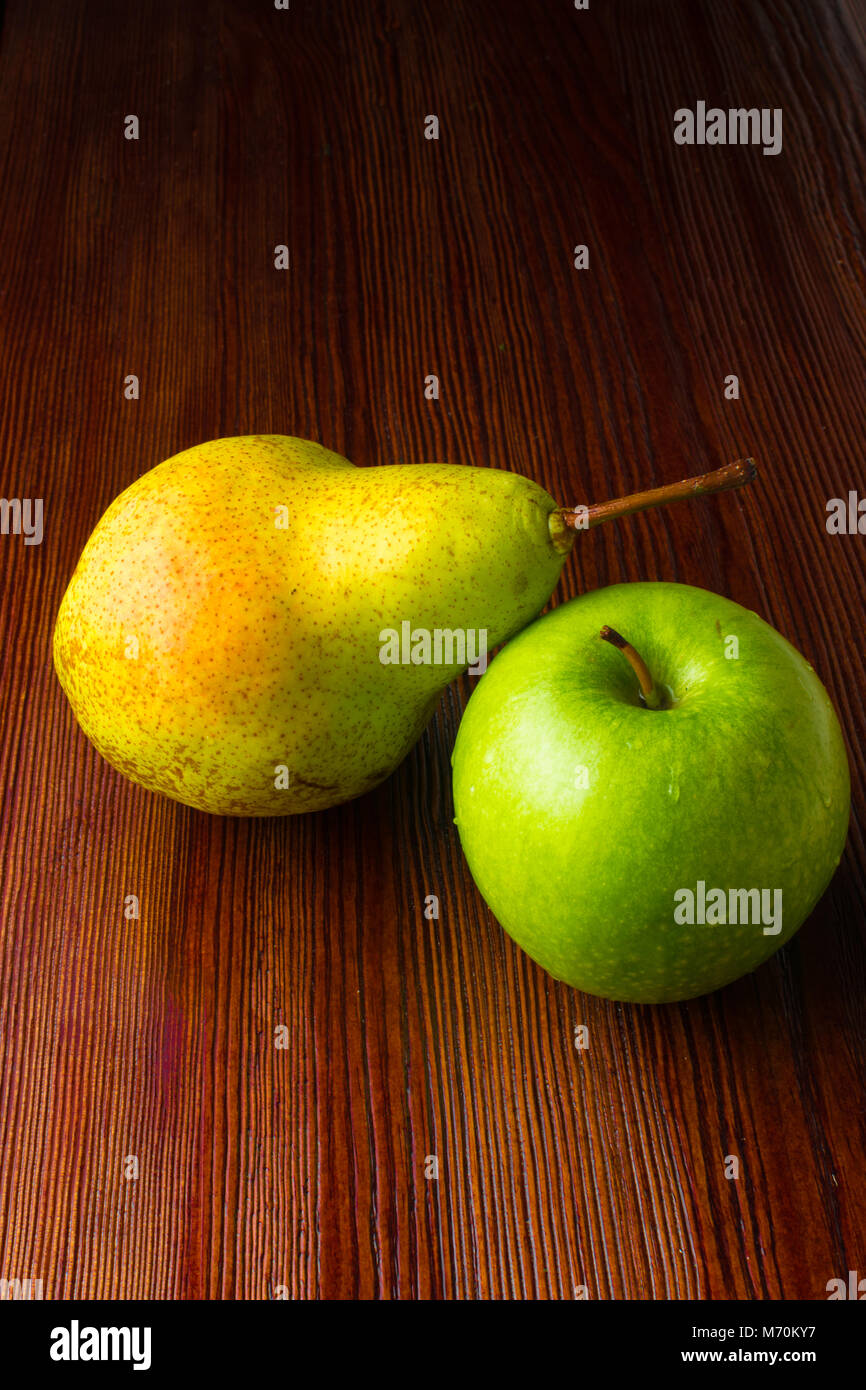 bio green organic apple and pear on wood ktable Stock Photo - Alamy