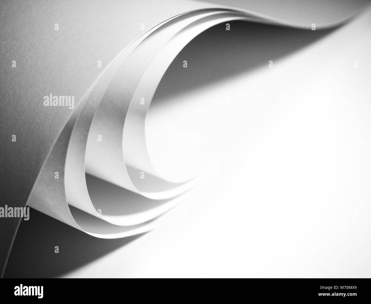Curved sheets of paper Stock Photo - Alamy