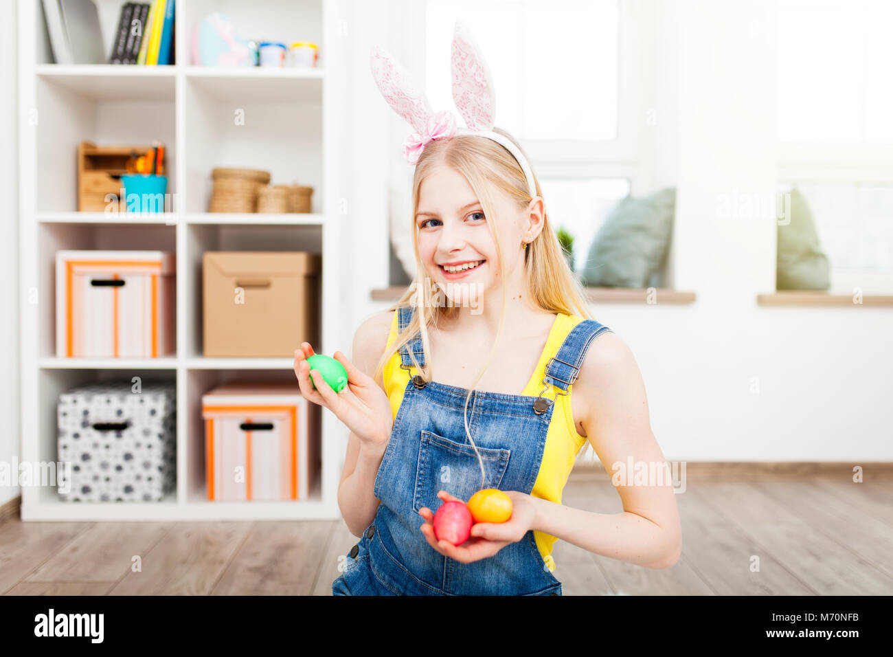 Teenage girl holding Easter eggs Stock Photo - Alamy