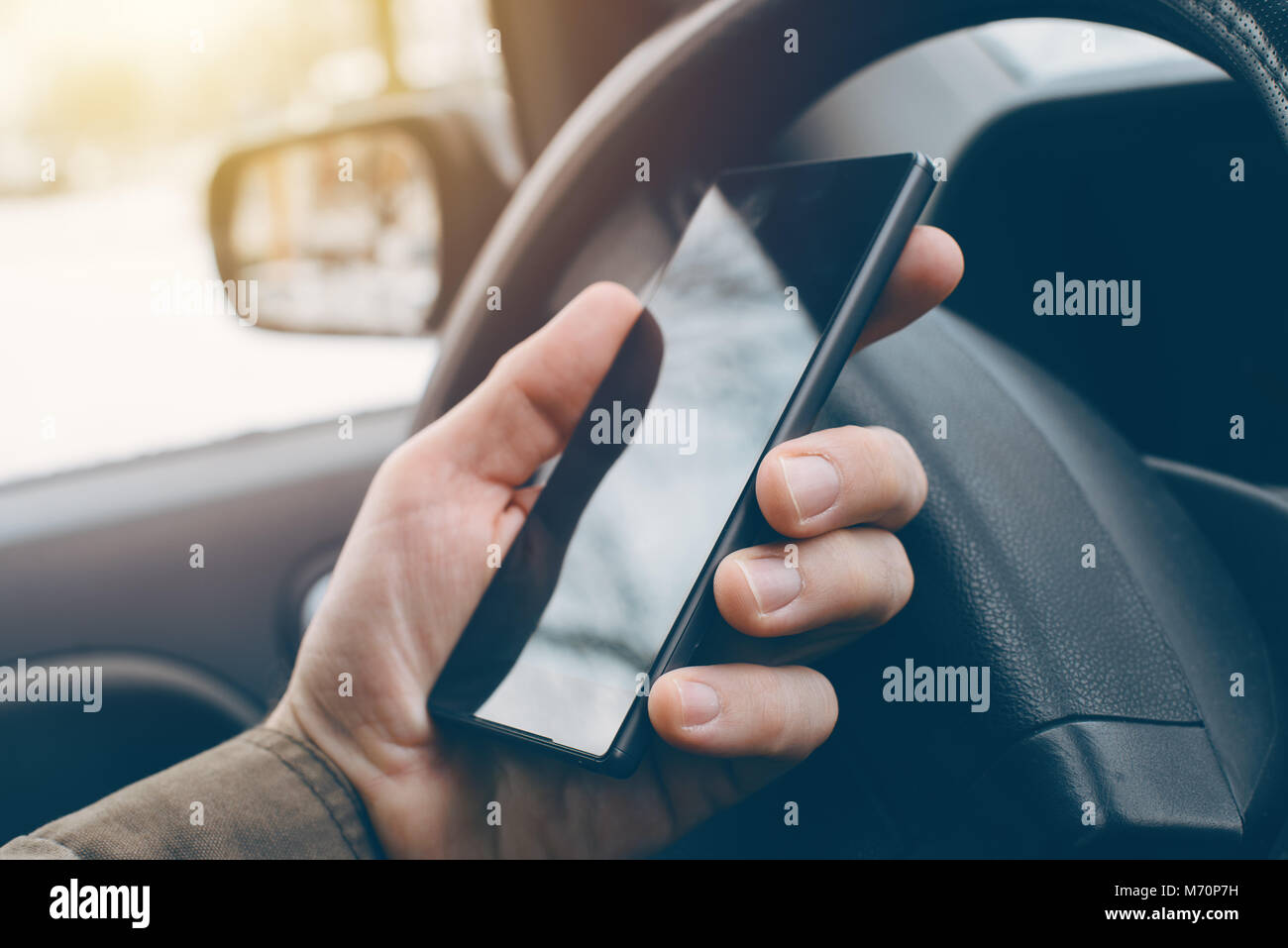 Man driving car and using mobile phone for texting, dangerous and ...