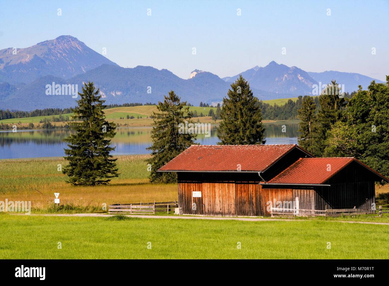 Bavarian farm by an Alpine lake on the romantic road in Germany Stock ...