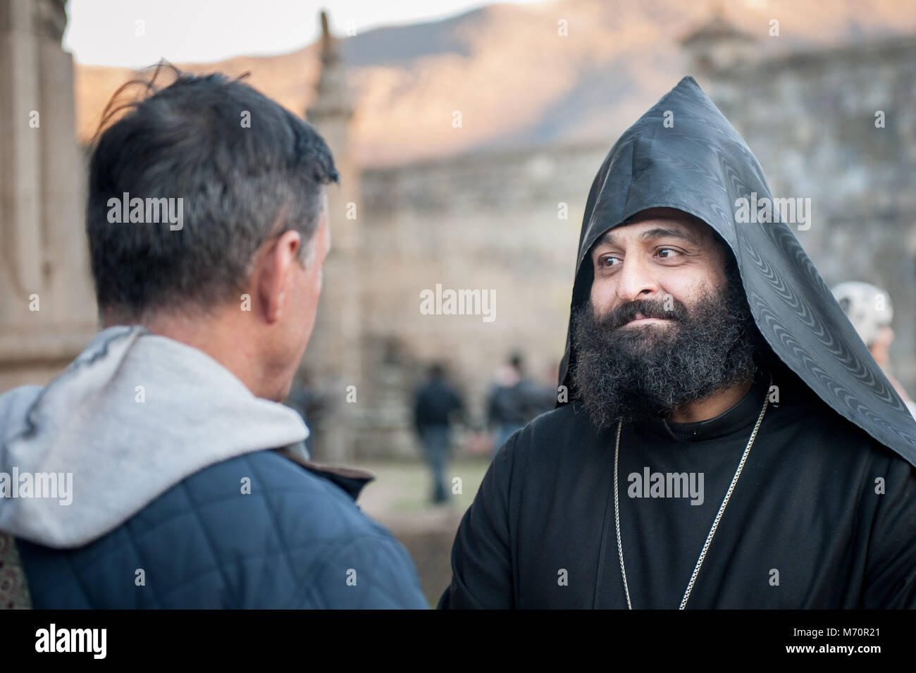 Orthodox monk and devotee at theTatev monastery in Armenia Stock Photo ...
