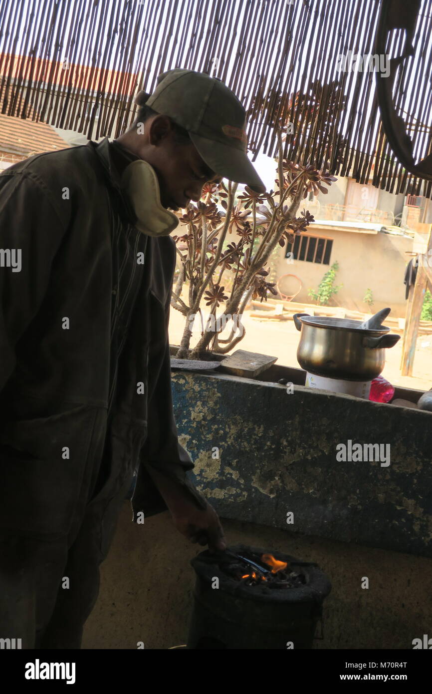 Artisan at work in zebu horn craft workshop, Antsirabe, At horn factory ...