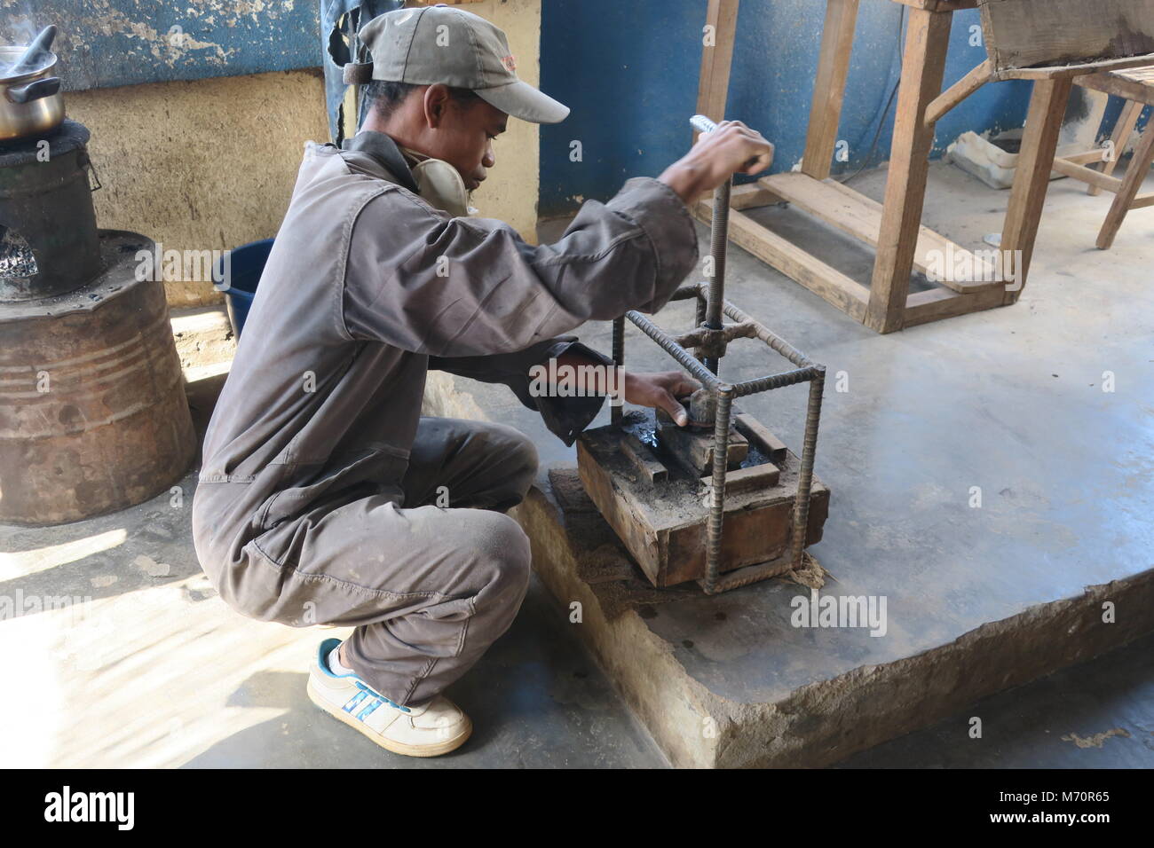 Artisan at work in zebu horn craft workshop, Antsirabe, At horn factory ...