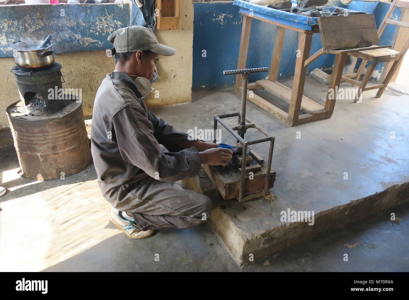 Artisan at work in zebu horn craft workshop, Antsirabe, At horn factory ...