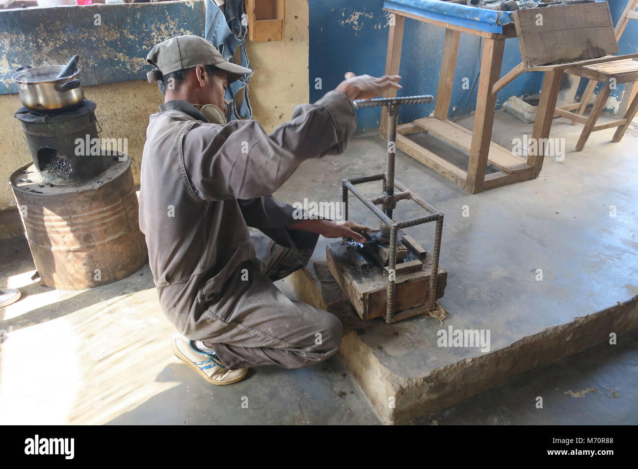 Artisan at work in zebu horn craft workshop, Antsirabe, At horn factory ...