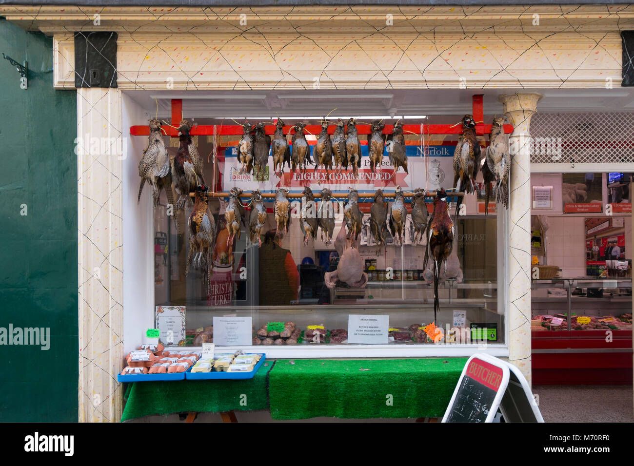 Game birds hanging outside Arthur Howell butcher in Wells-Next-The-Sea ...