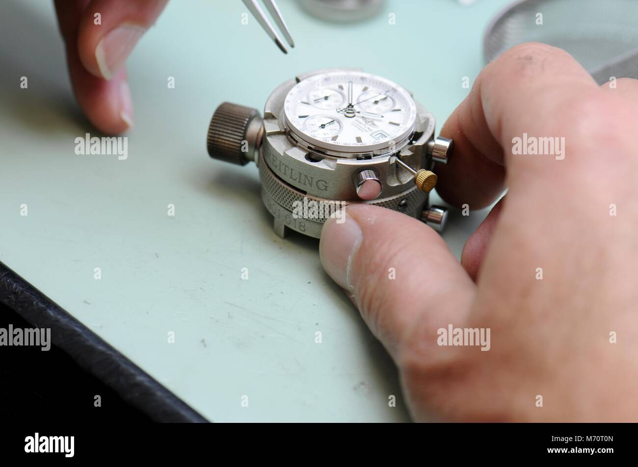 Watchmaker, repair specialist putting watch back together Stock Photo ...