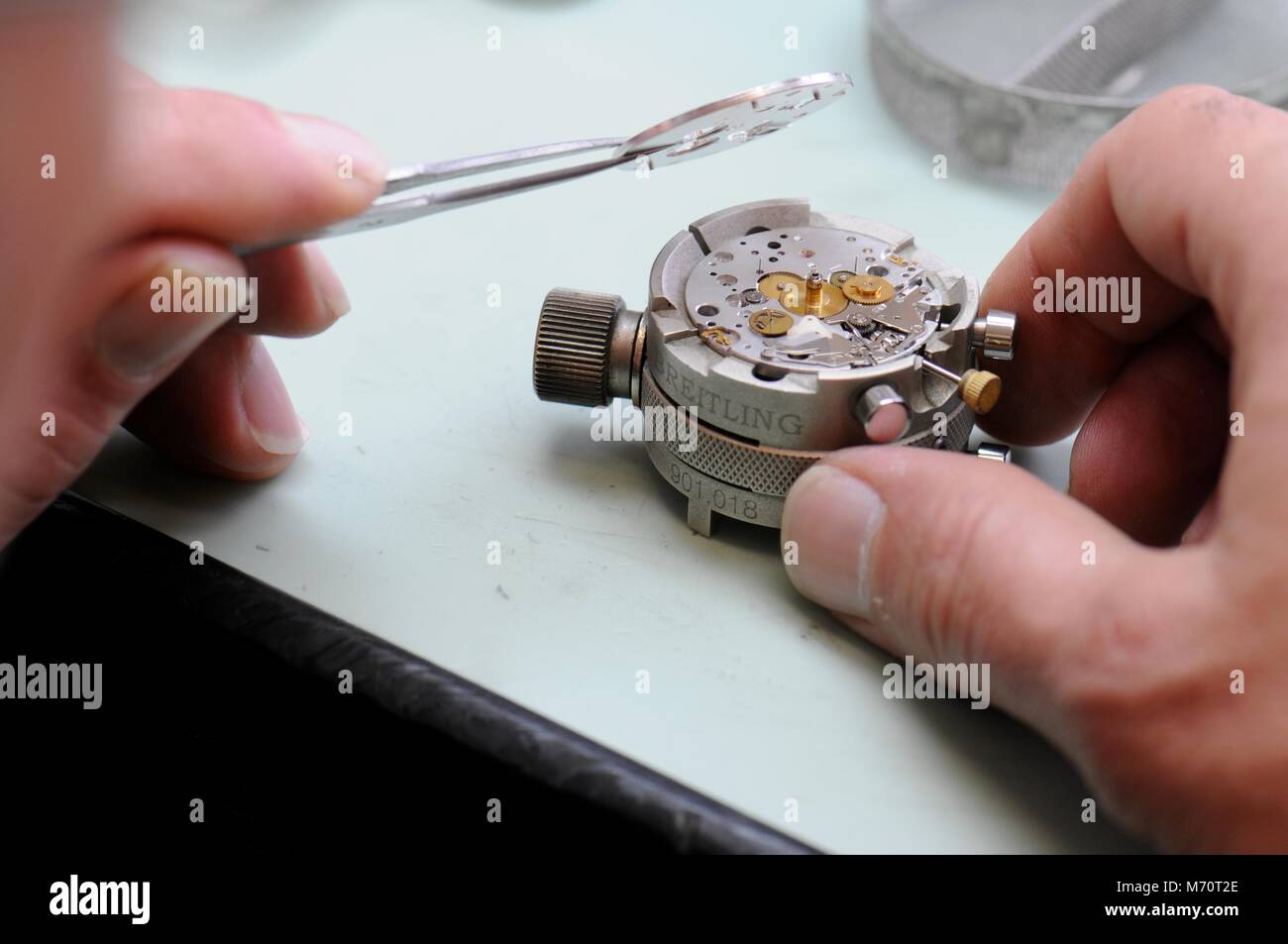 Watchmaker, repair specialist putting watch back together Stock Photo ...
