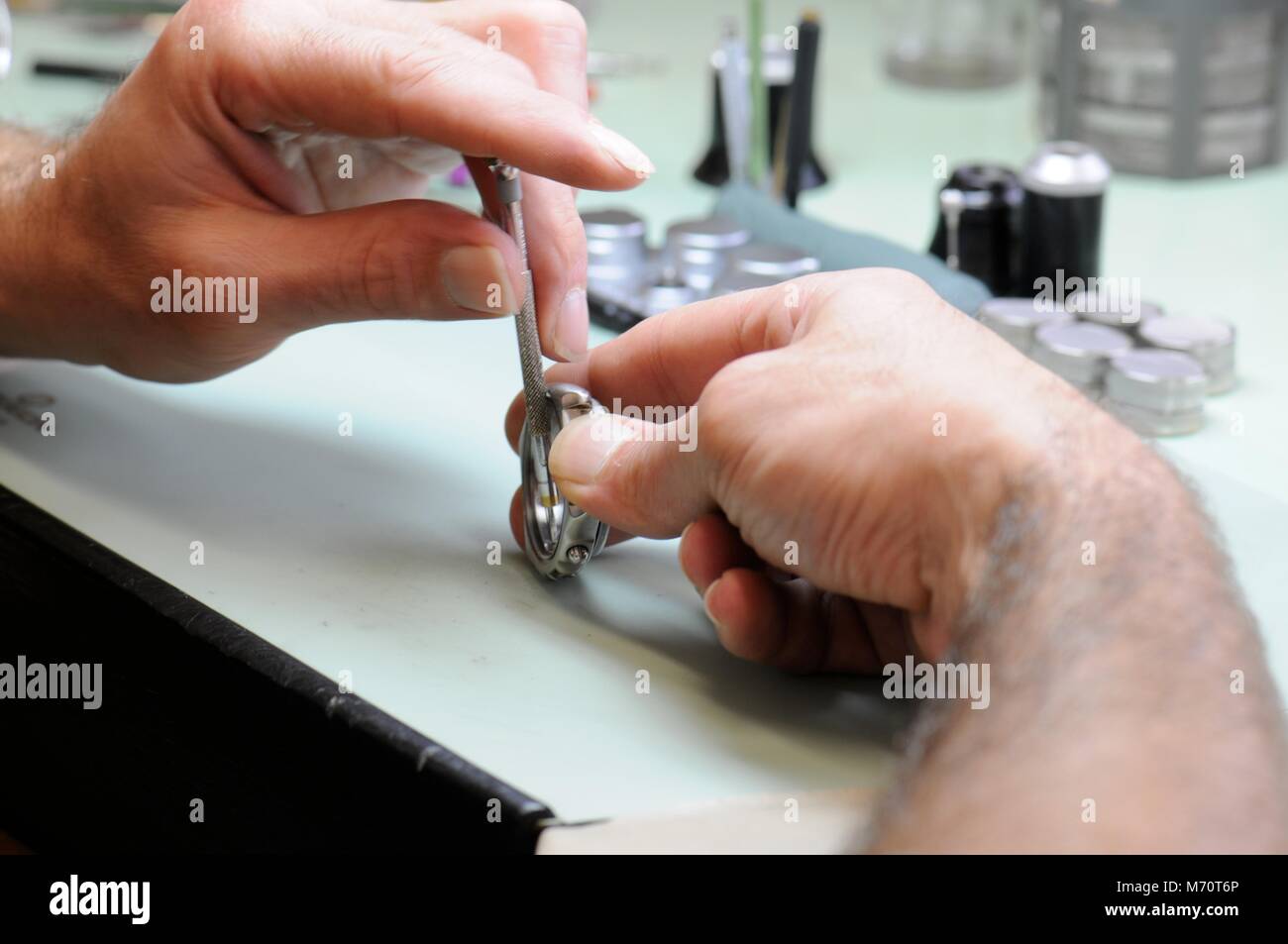 Watchmaker, repair specialist putting watch back together Stock Photo ...