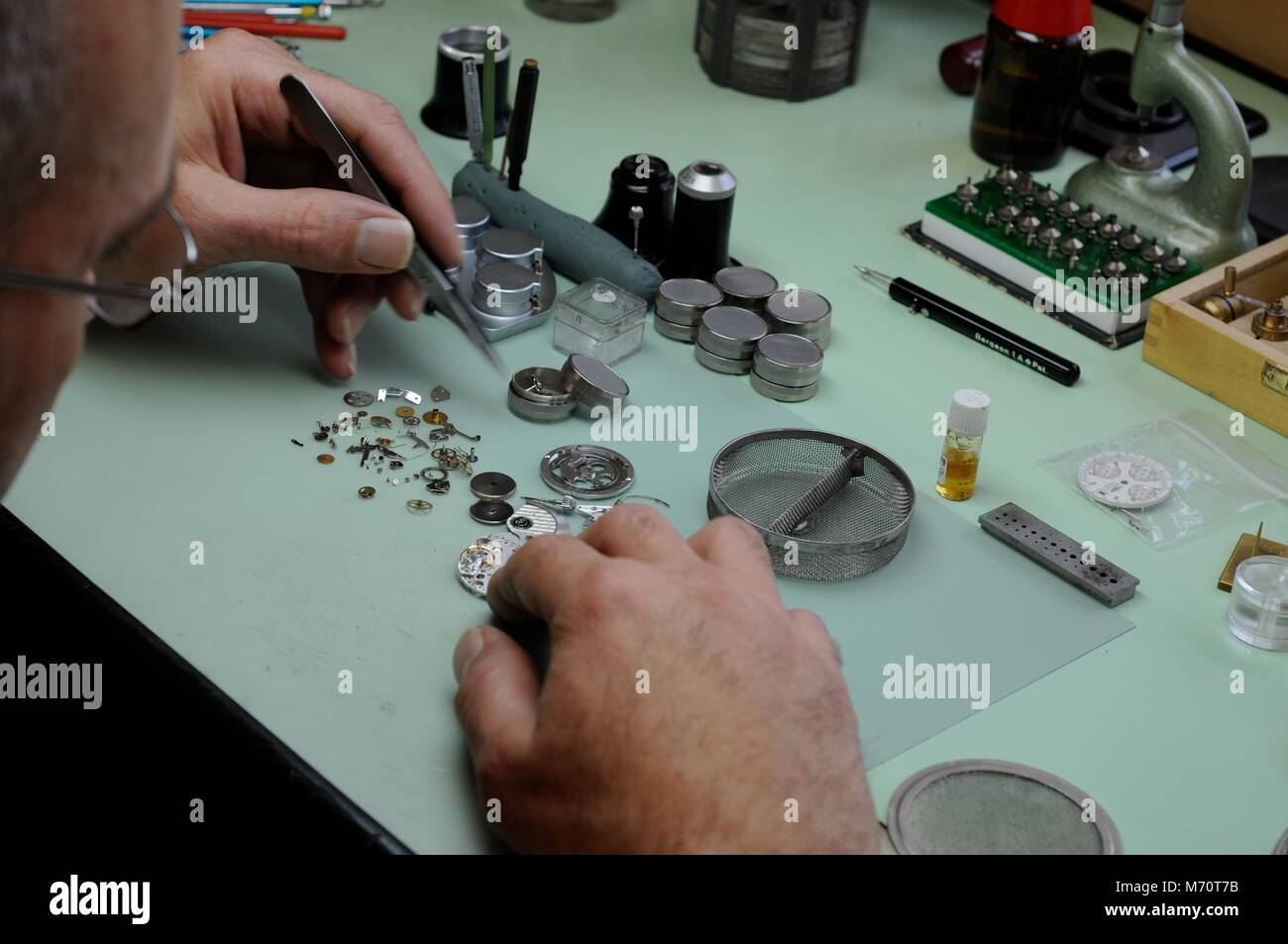 Watchmaker, repair specialist putting watch back together Stock Photo ...